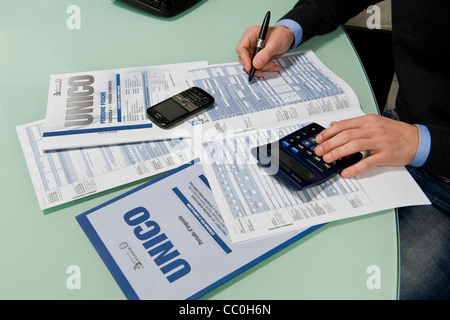 Compiling tax return Stock Photo - Alamy