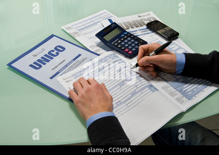 Compiling tax return Stock Photo - Alamy