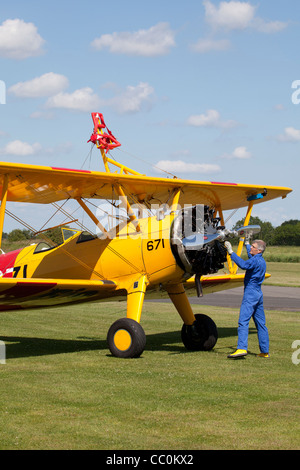 Boeing Stearman A75L300 Kaydet G-CGPY in flight with wingwalker on top ...