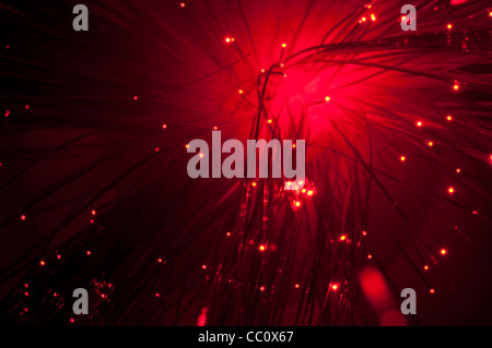 Optical fibers of fiber optic cable. Internet technology.Red color ...
