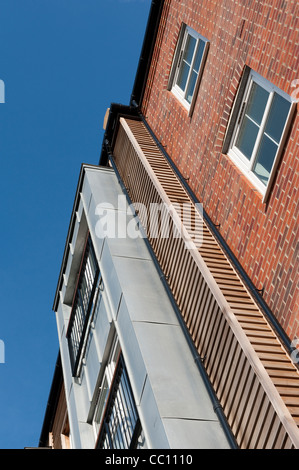 Looking up a tall newly constructed brick apartment building Stock ...