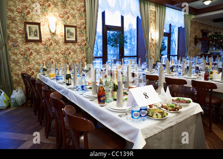 Russian restaurant. Detail of a fancy table set for Christmas dinner ...