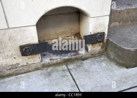 antique boot scraper built into the wall of a historic old office ...