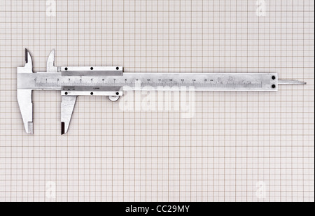 Vernier-caliper on graph paper background Stock Photo - Alamy