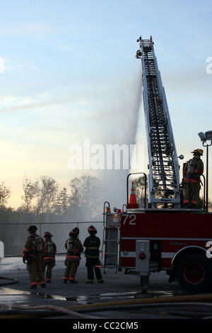 Multiple sources of water being projected at a fire scene Stock Photo ...