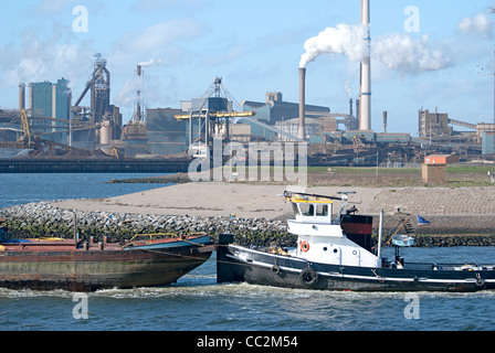 Tugboat pushing cargo ship in Foynes Harbour, County Limerick Ireland ...