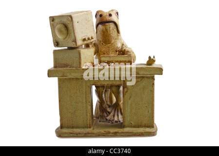 Pottery ornament depicting a frog using a computer Stock Photo - Alamy