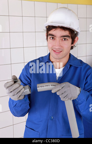 portrait of young apprentice handling u turn Stock Photo - Alamy