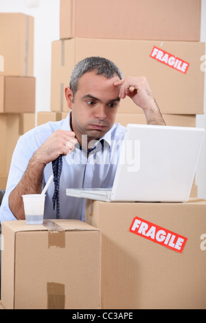 Stressed warehouse worker Stock Photo - Alamy