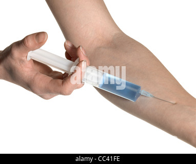 self injection scene with a big syringe filled with blue fluid. Studio ...