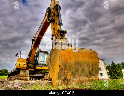 digger showing menacing strength, power, size, weight of this road ...