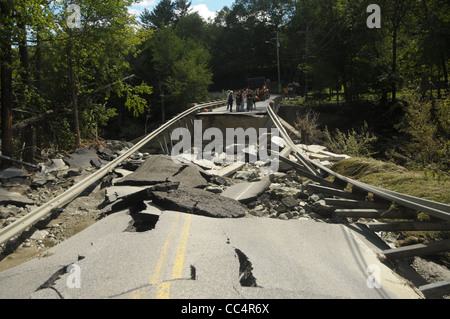 The road surface crumpled by tropical storm Irene shows the damage ...