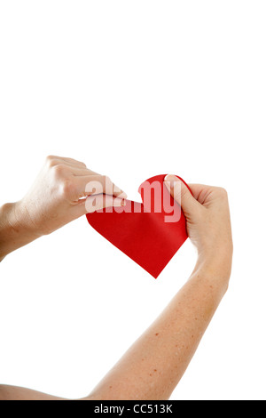 Hands Ripping paper heart Stock Photo - Alamy