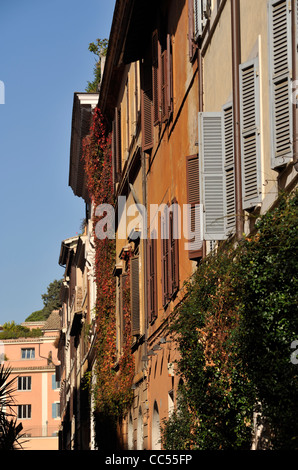Buildings of ancient Rome at the street Via dei fori imperiali in the ...
