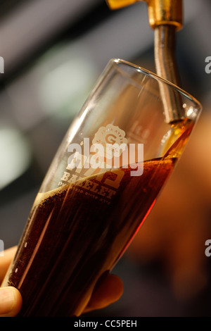 A beer glass displays the Israeli microbrewery Bazelet beer logo Stock ...