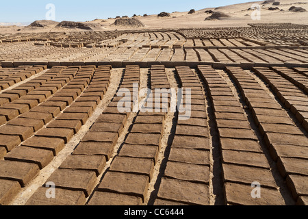 Newly formed mud bricks being made at the ancient site of Dush, South ...