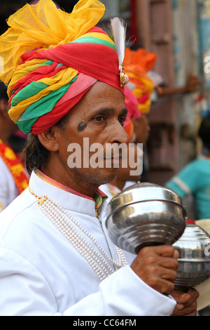 Indian man playing musical instrument with decorated cow Stock Photo ...