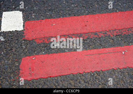Red Route double red lines on road, UK Stock Photo - Alamy