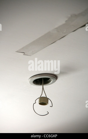 broken light fitting on roof ceiling in house home property Stock Photo ...
