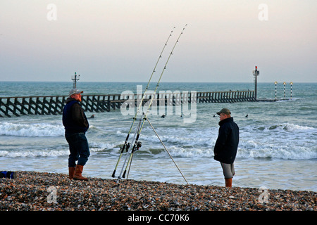 Winters Evening Fishing on Littlehampton West Beach with surfers in ...