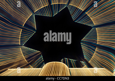 Light trails with a star shape, ferris wheel, carousel Stock Photo - Alamy
