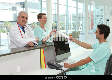 Busy hospital reception area Stock Photo - Alamy