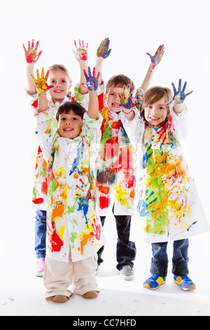 Messy Hispanic children finger painting Stock Photo - Alamy