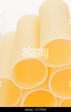 close up of raw italian pasta in plate on table Stock Photo - Alamy