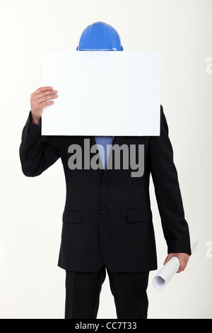 construction businessman hiding his face with a blank poster Stock ...