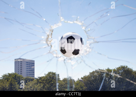 Soccer Ball Smashing through Window Stock Photo - Alamy