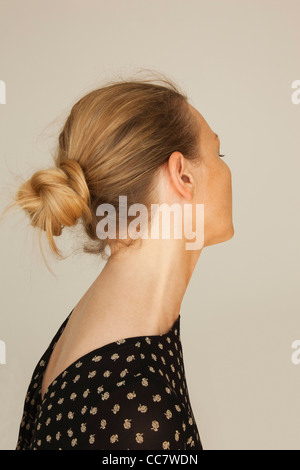 Portrait of an attractive blond german model with a brown sweater on a ...