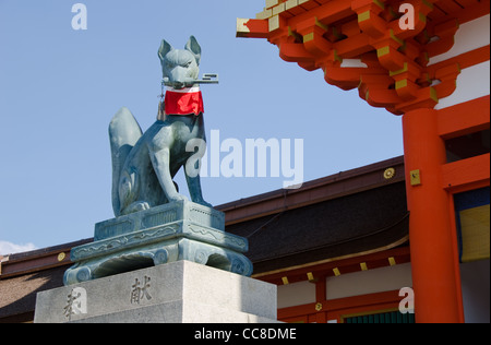 A statue of a fox at Fushimi Inari Taisha shrine near Kyoto city Japan ...