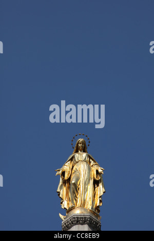 Virgin Mary golden statue Stock Photo - Alamy