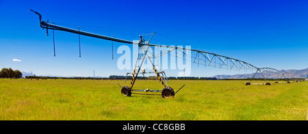 Large irrigation equipment on wheels watering a grain field, East of ...