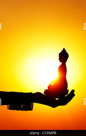 Girls are silhouetted against the setting sun as they enjoy a spring ...
