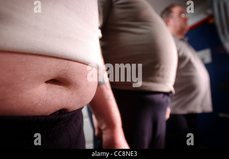 Obese men get weighed at a health clinic Stock Photo - Alamy