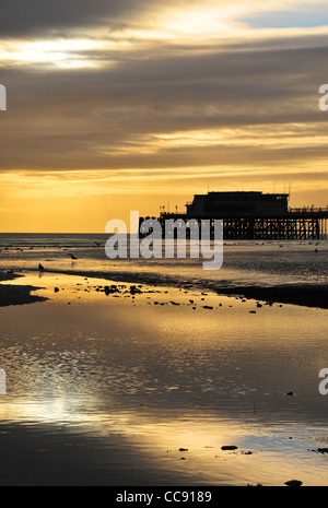 Worthing pier and beach at sunset on a cold winters day West Sussex ...