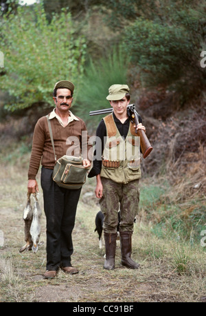 Two Men Hunting Rabbits With Their Dog, A Village Beyond . 1209 Two men ...
