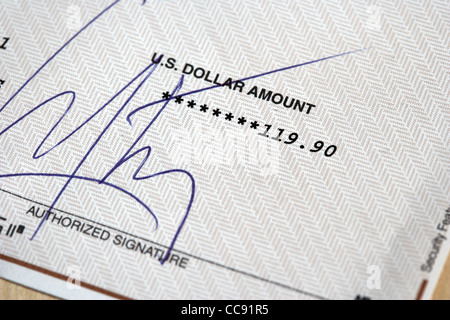 us dollar cheque issued as payment with dollar amount and signature ...