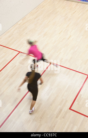 Two female squash players on a squash court Stock Photo - Alamy