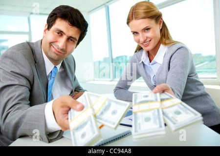group of successful business people with money isolated on white ...