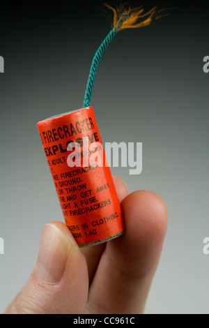 Fireworks, firecracker with a burning fuse Stock Photo - Alamy