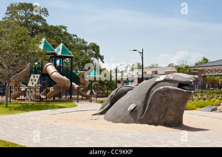 Neptune park includes playground equipment and a statue of a whale for ...