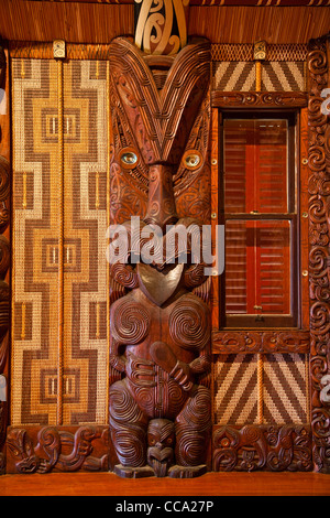 Maori Meeting House, wharenui, tekoteko on top, carved wood trim ...