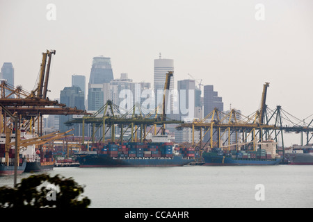 Container ships are moored at the quayside of the Brani Terminal at the ...