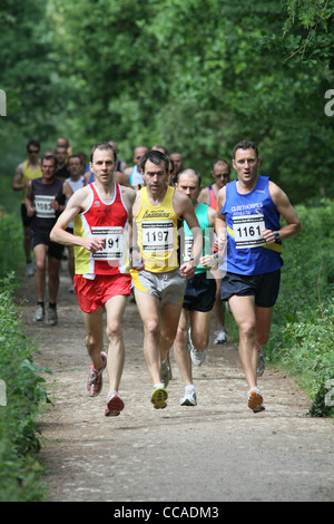 Long distance runners are running on the track Stock Photo - Alamy