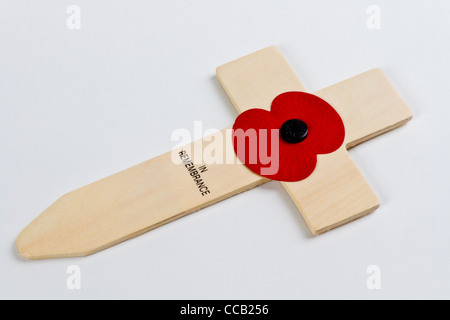Remembrance wooden cross with a poppy - studio shot with a white ...