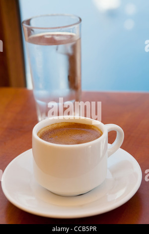 Greek coffee brewed in the hot sand in a traditional Greek coffee house ...