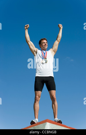 Athletes standing on podiums Stock Photo - Alamy
