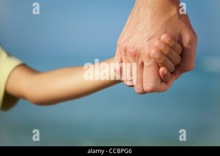 adult and child holding hold hands sign white guidance parent Stock ...